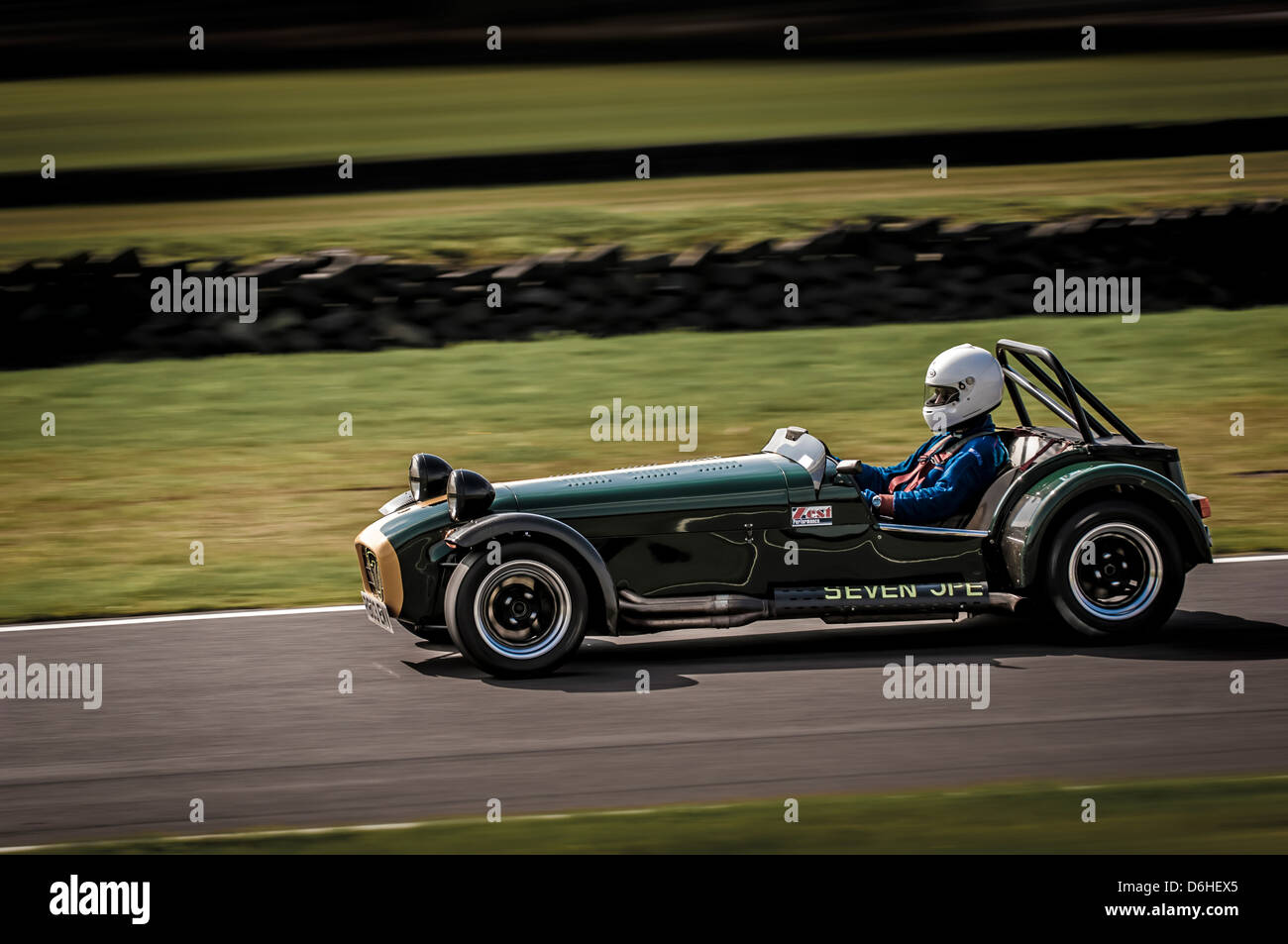 Side view of green Caterham car racing at Cadwell park racetrack Stock ...
