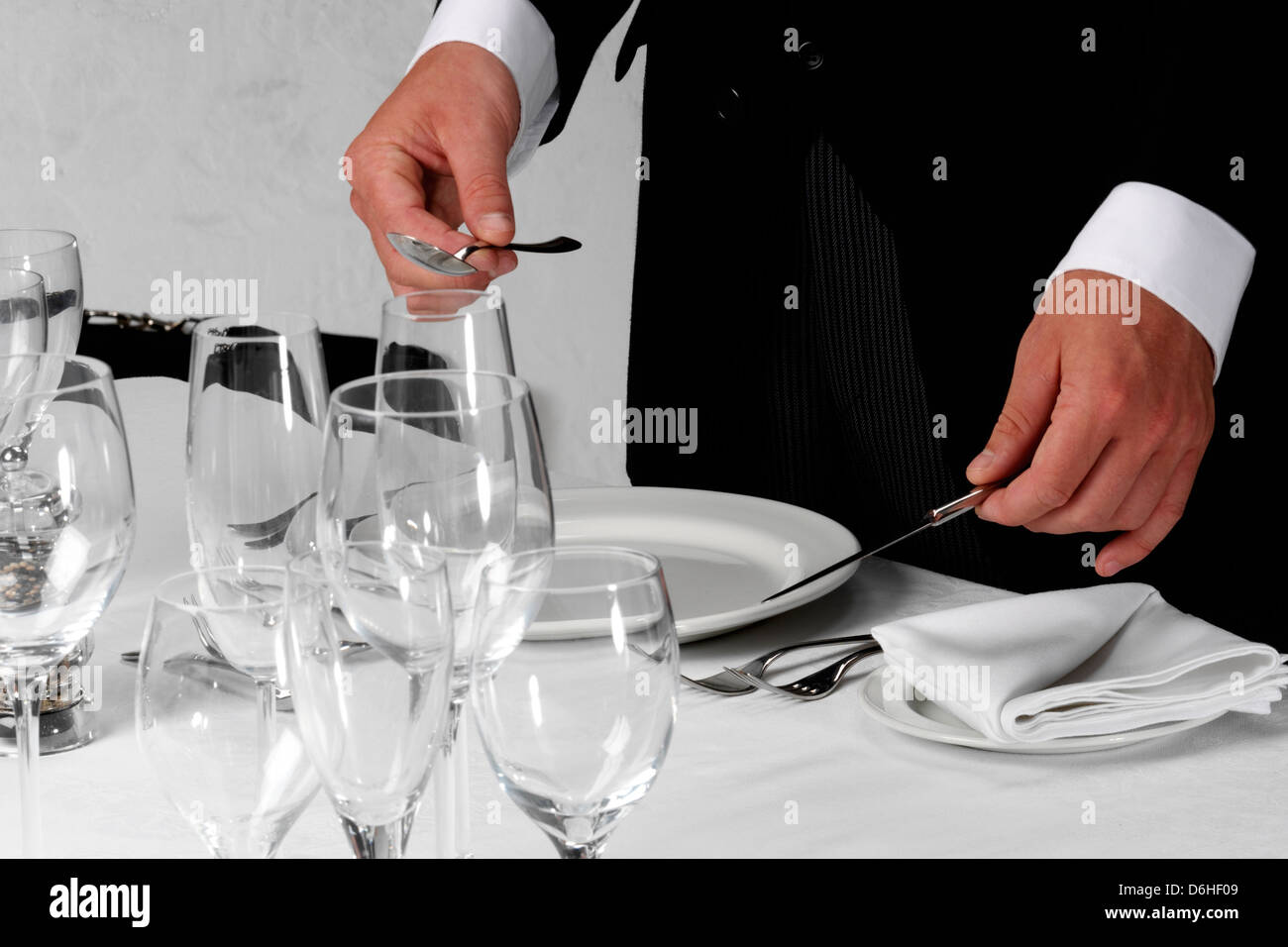 Waiter setting table Stock Photo - Alamy