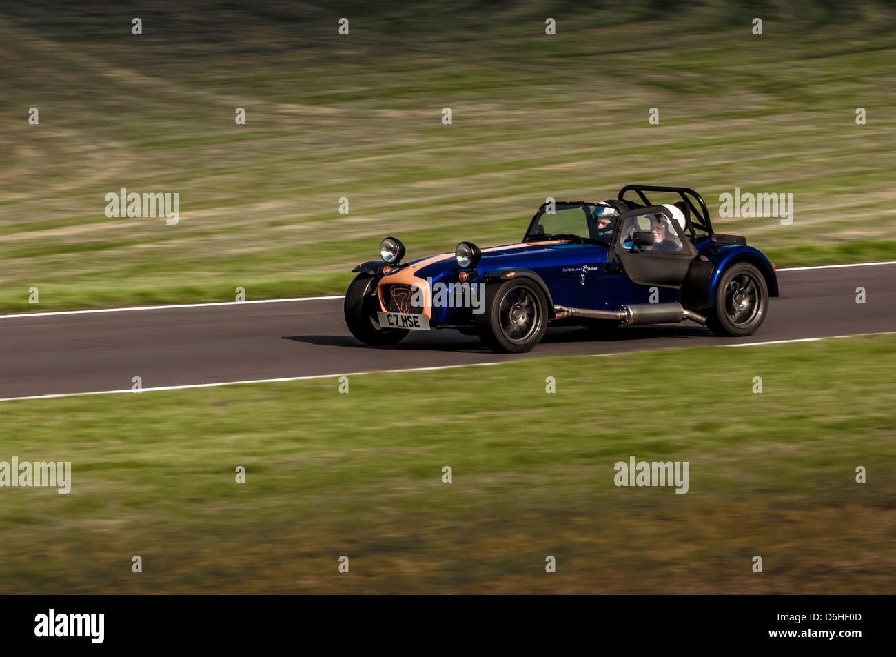 Side view of Caterham sports car racing at Cadwell park racetrack Stock ...
