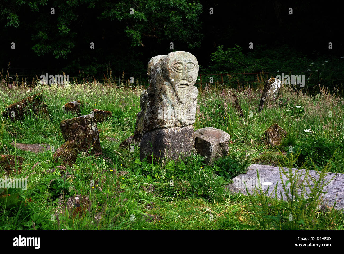 A two faced Celtic figure, Janus Stone, Caldragh graveyard, Boa Island ...