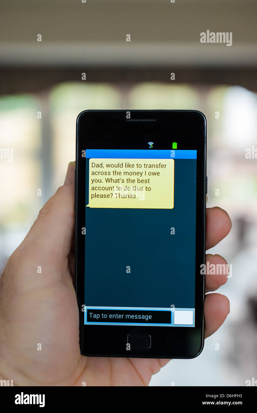 Text message from son to father about repaying a loan Stock Photo - Alamy