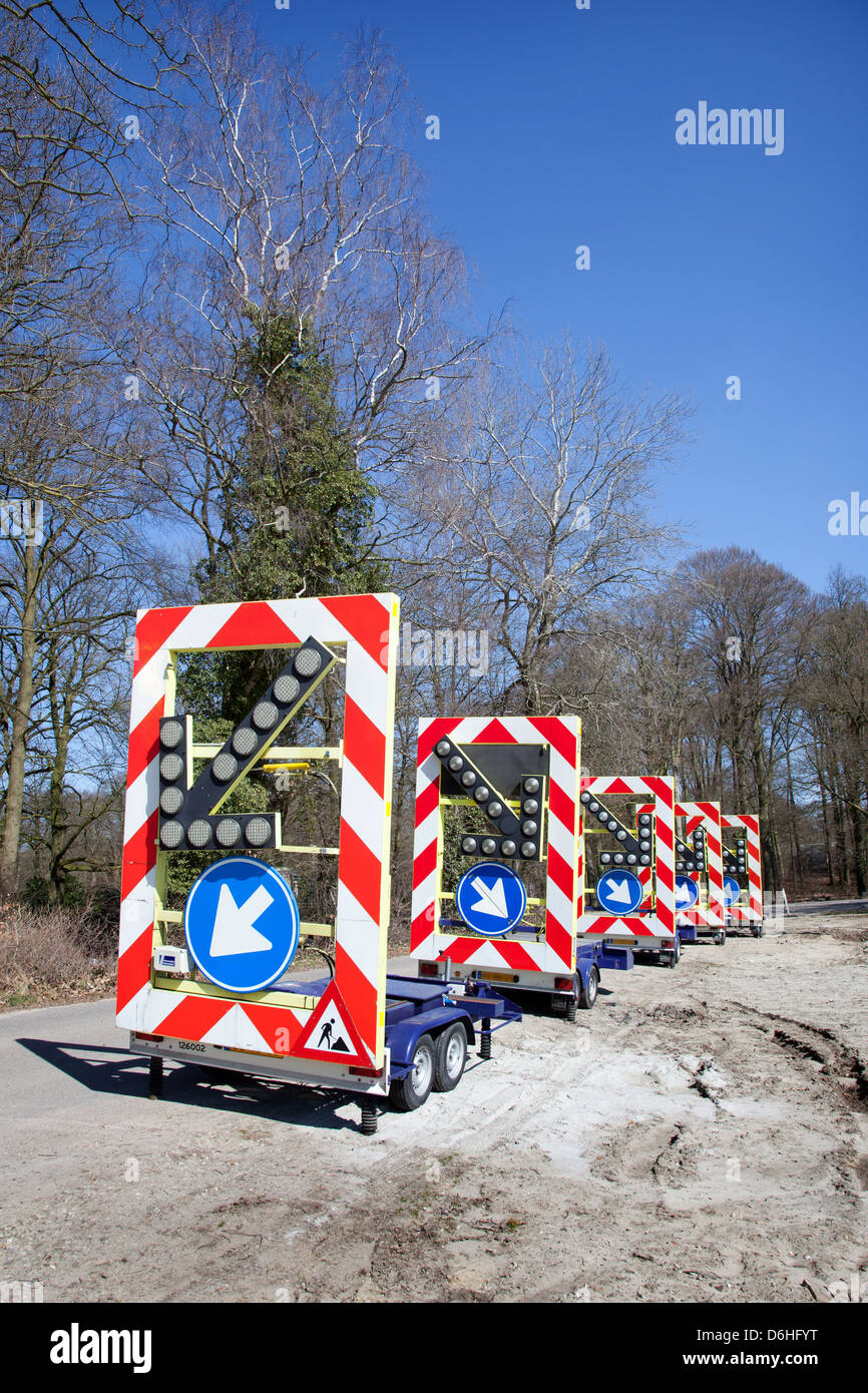 row of traffic warning signs on wheels Stock Photo - Alamy
