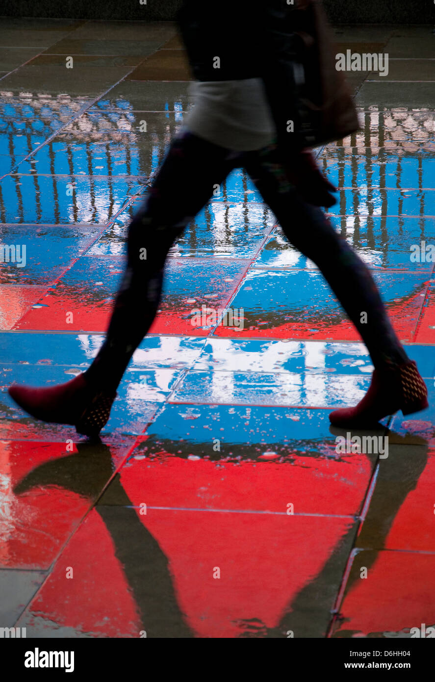 neon sign reflections on wet pavement, piccadilly circus, london ...