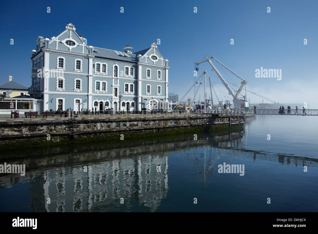 Old Port Captain's Building (1904), and tourists on swing bridge ...