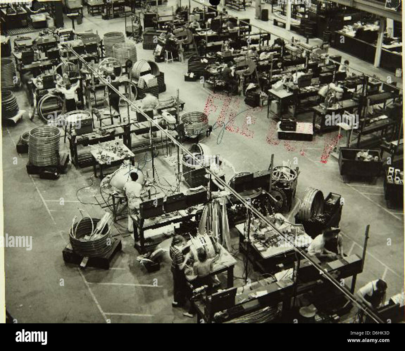 This photograph depicts personnel at the Convair/General Dynamics plant ...