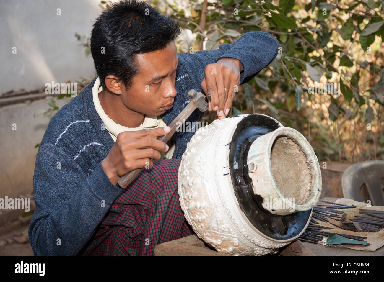 Silversmith making silver bowl, U Ba Mhin Daw Khin Lay Company, Ywa ...