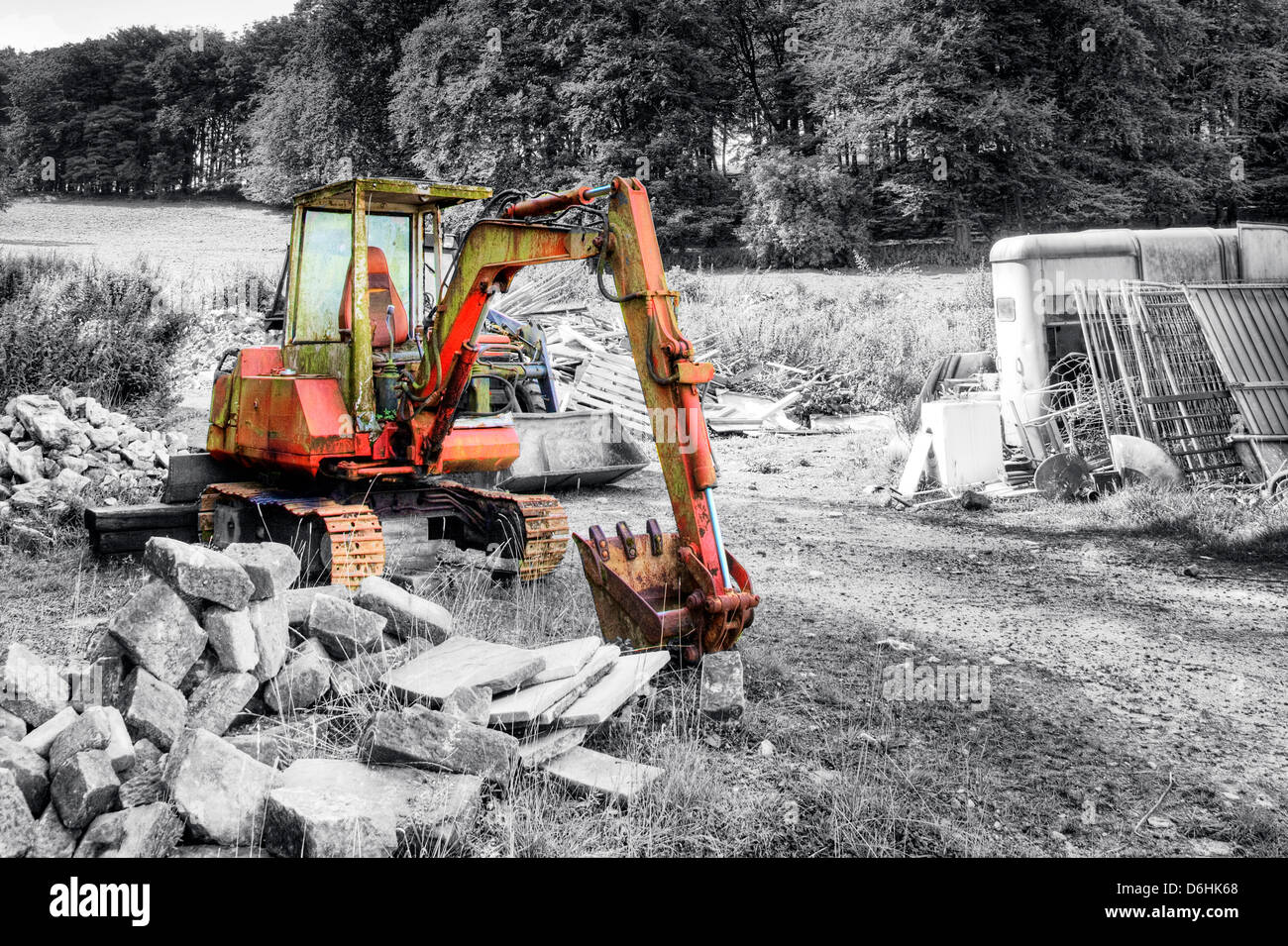 Construction digger with caterpillar tracks parked.Black and white with ...
