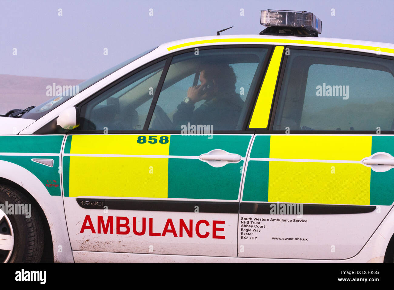 Car ambulance service driver on mobile phone sat in vehicle Stock Photo ...