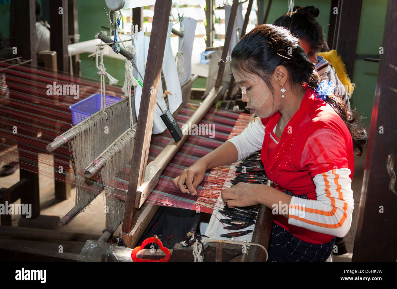 Woman weaving on a loom, Thein Nyo silk weaving workshop, Amarapura ...