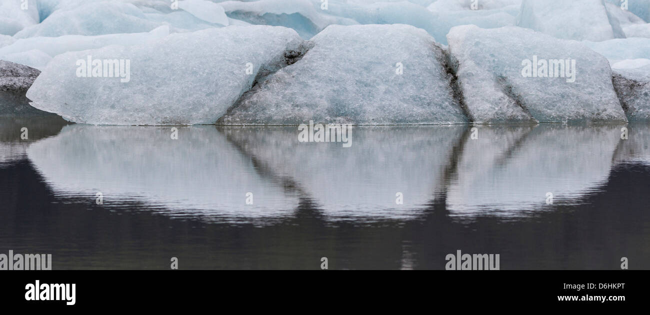 Iceland. Fjallsjokull Glacier reflects patterns in water. Credit as ...