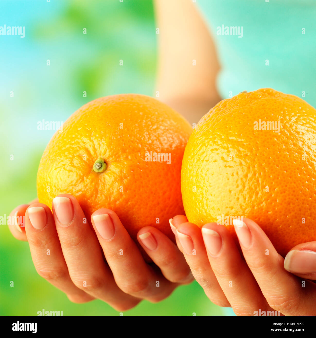 hands holding oranges Stock Photo - Alamy
