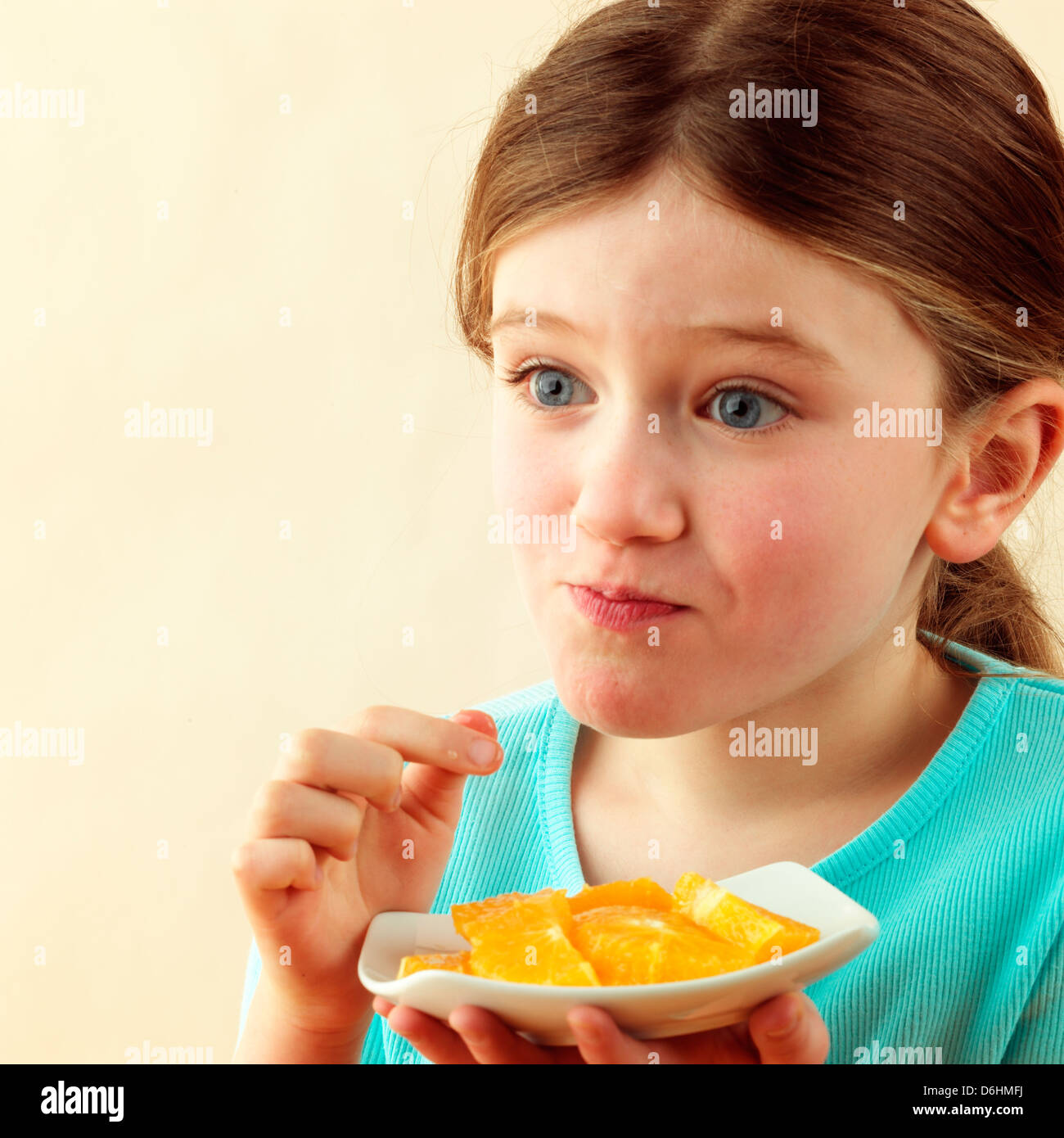 Child eating slices of fruit hi-res stock photography and images - Alamy
