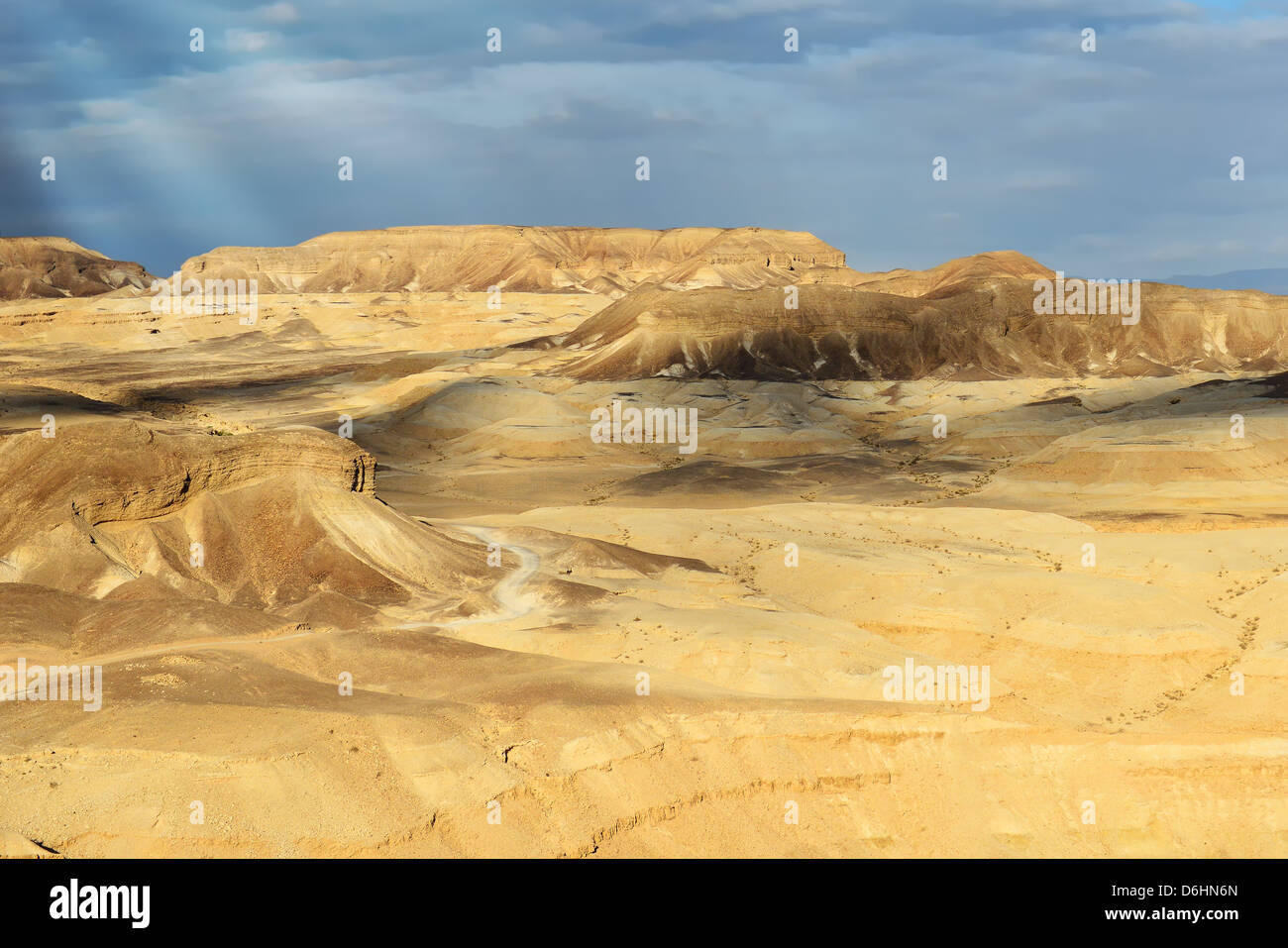 Beautiful scenery of the Israeli desert Negev. Clouds, sun and yellow ...