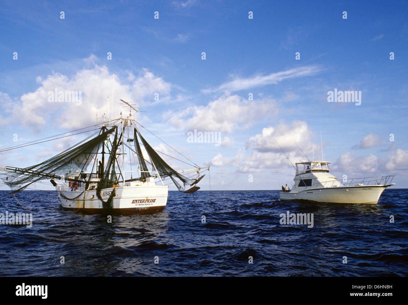 Offshore fishing boat trolling near a shrimp boat near Port Aransas ...