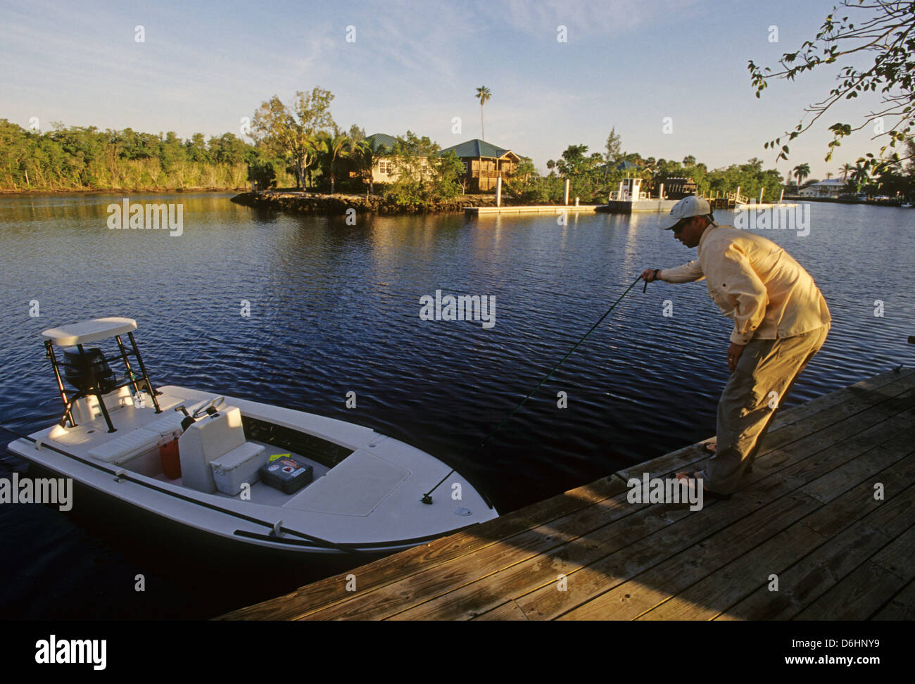 Launching their skiff hi-res stock photography and images - Alamy