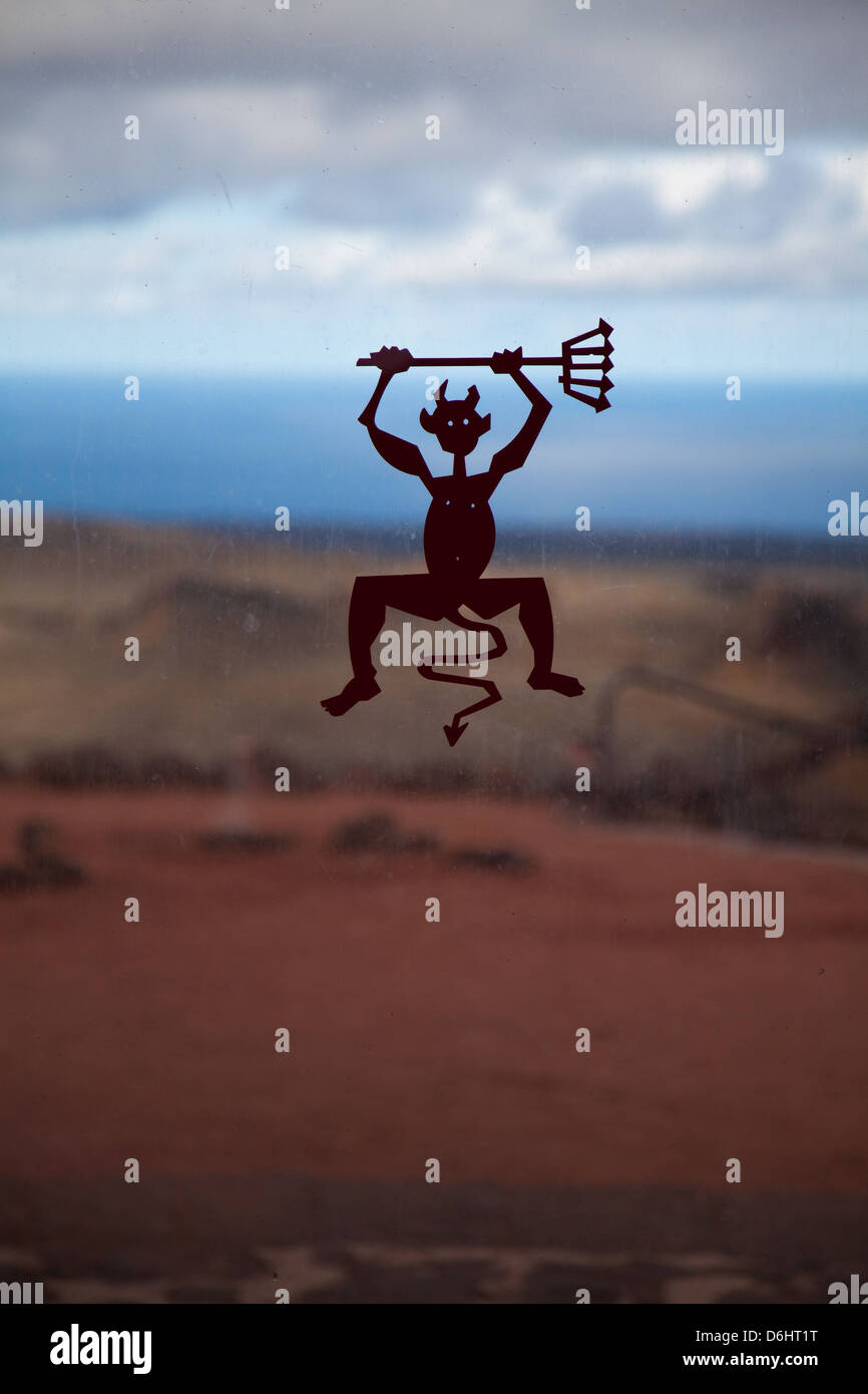 A devil design on a window overlooking Timanfaya National Park ...