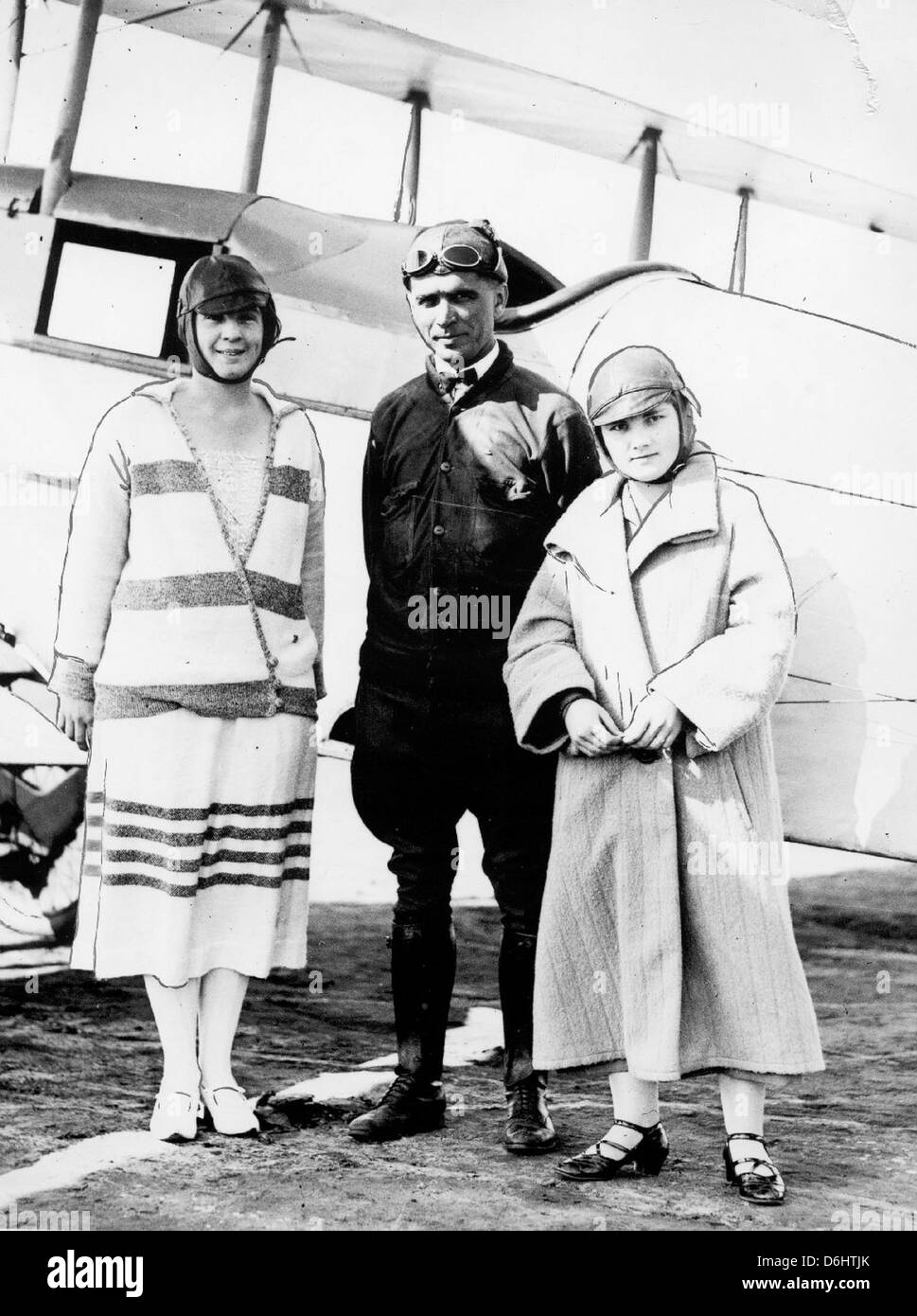 Clause Ryan, standing with two women passengers in front of a Ryan ...
