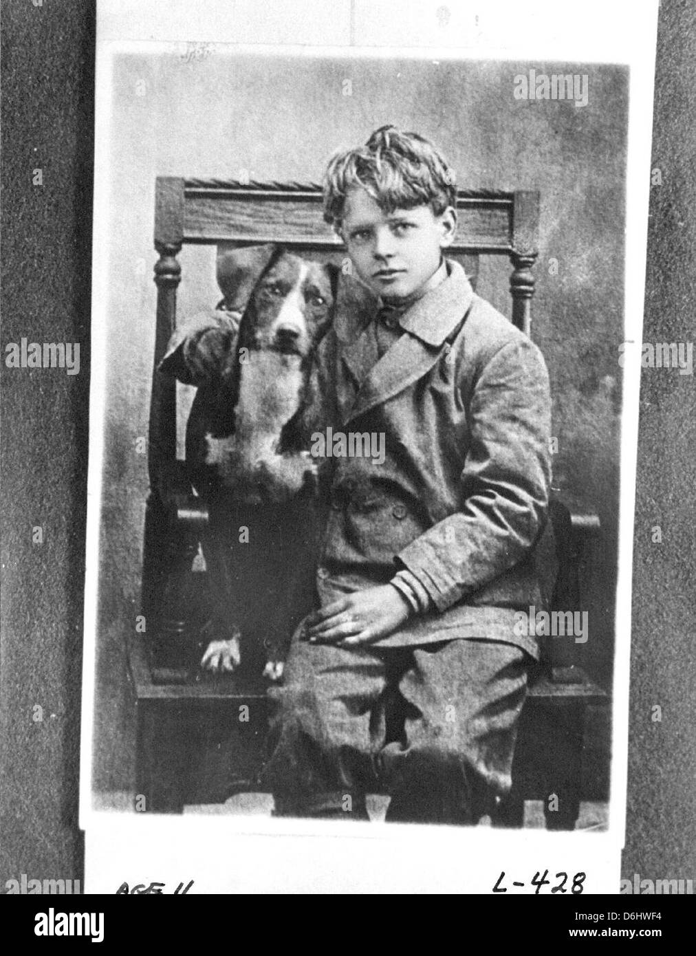 This image features Charles Lindbergh, with a child and a dog ...