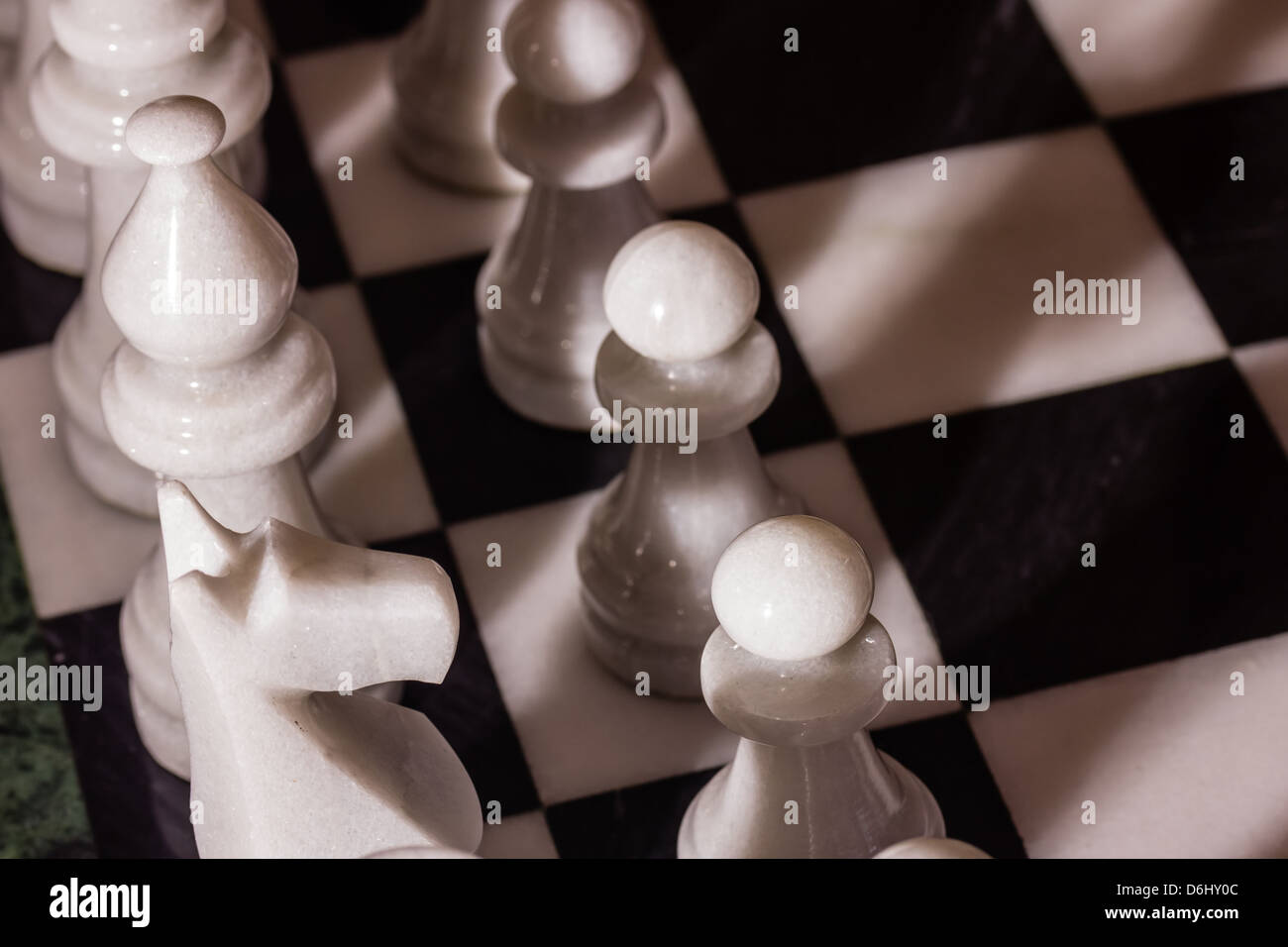 Dramatic closeup of chess board and pieces. Metaphor for teamwork ...