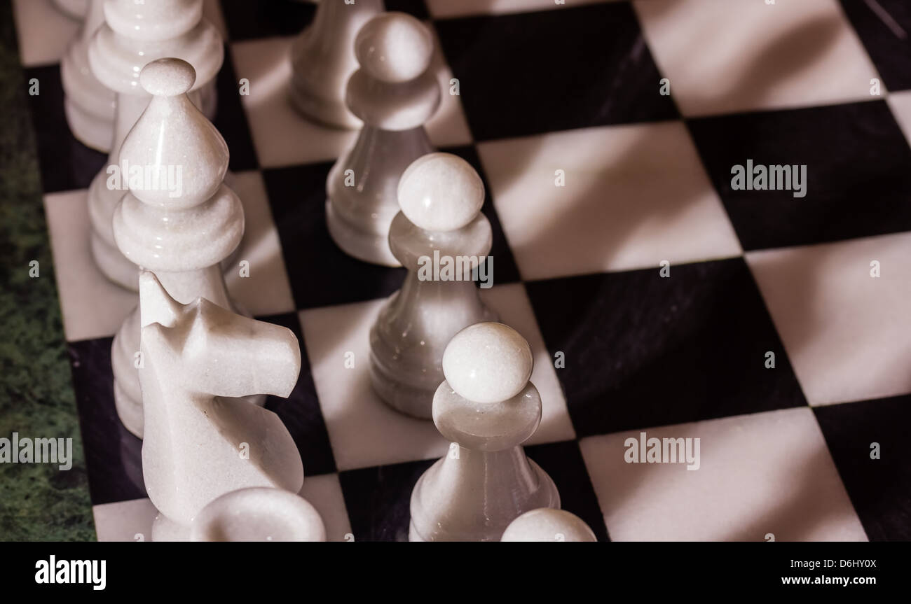 Dramatic closeup of chess board and pieces. Metaphor for teamwork ...
