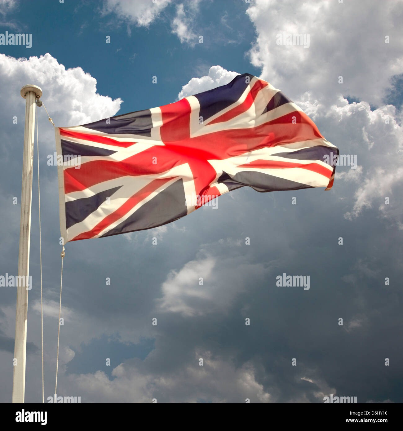 British flag on flagpole set against cloudy sky. brexit concept Stock ...