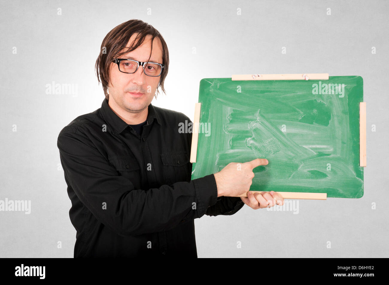 Man holding school board and pointing the finger Stock Photo - Alamy