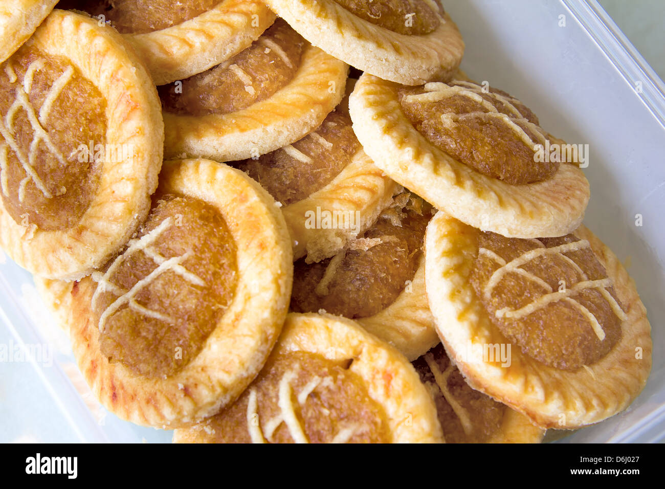 Pineapple Tart Pastry Stacked Up in Plastic Container Closeup Stock ...