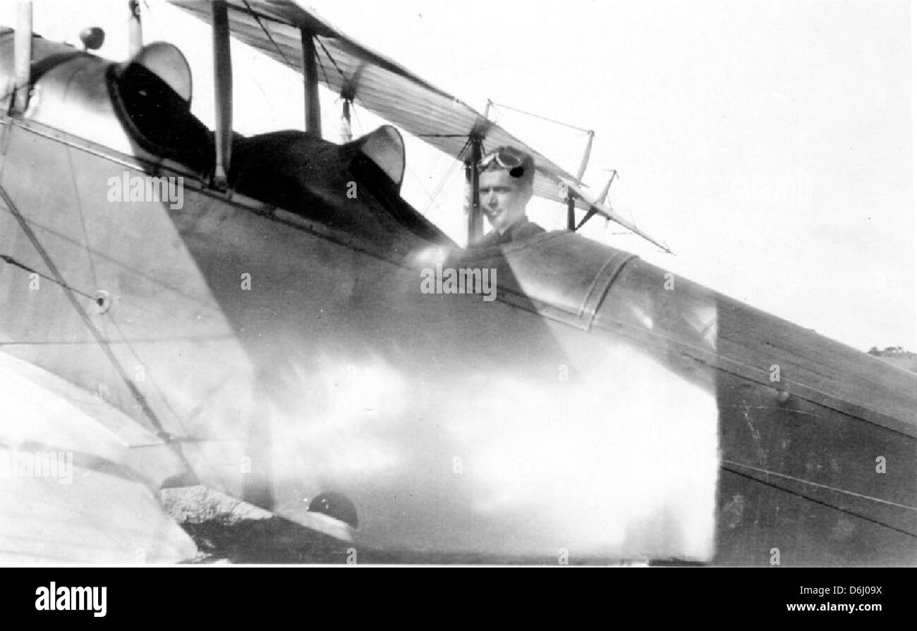 Claude Ryan, founder of Ryan Aeronautical, stands beside a Jenny ...