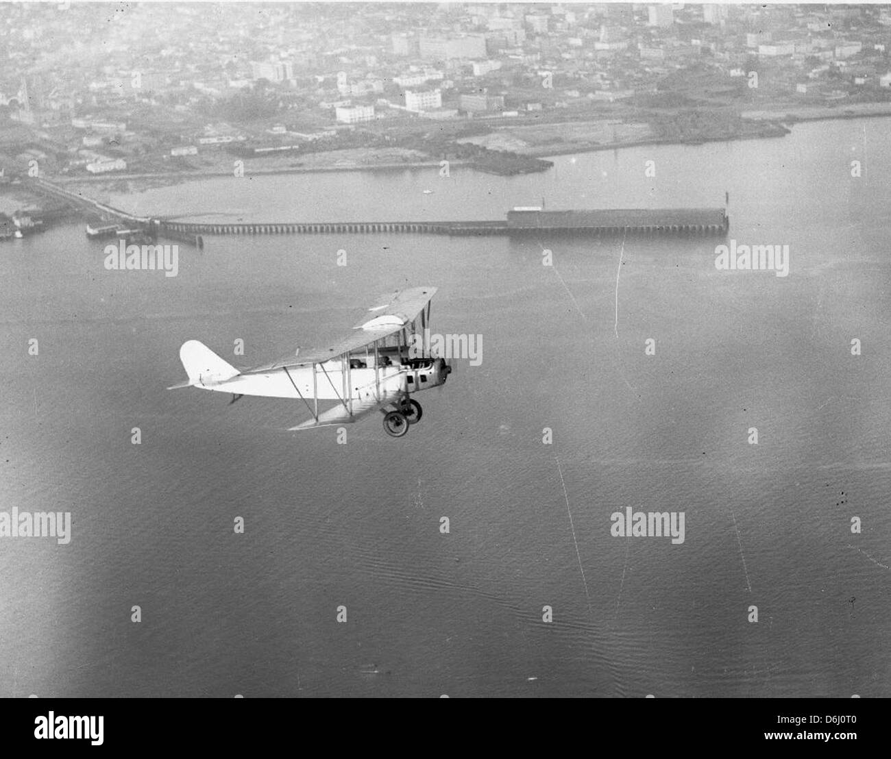 04-00150 "Oneta" flying above water. A Ryan cabin standard, 180 HP ...