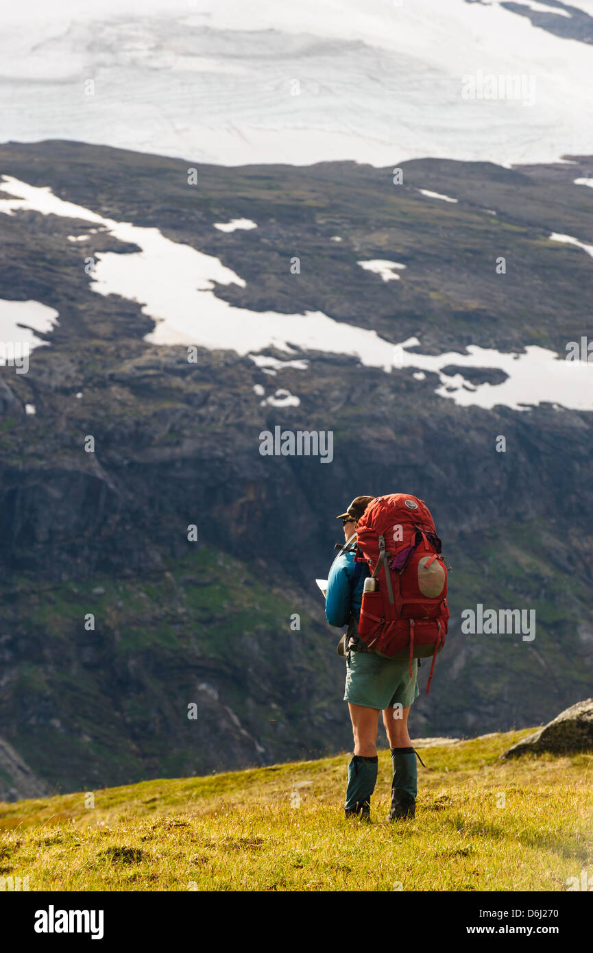 Sweden, Norrbotten. Woman backpacking in Vadvetjaakka National Park ...
