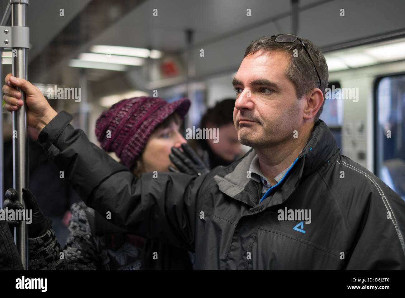 Man on subway train hi-res stock photography and images - Alamy