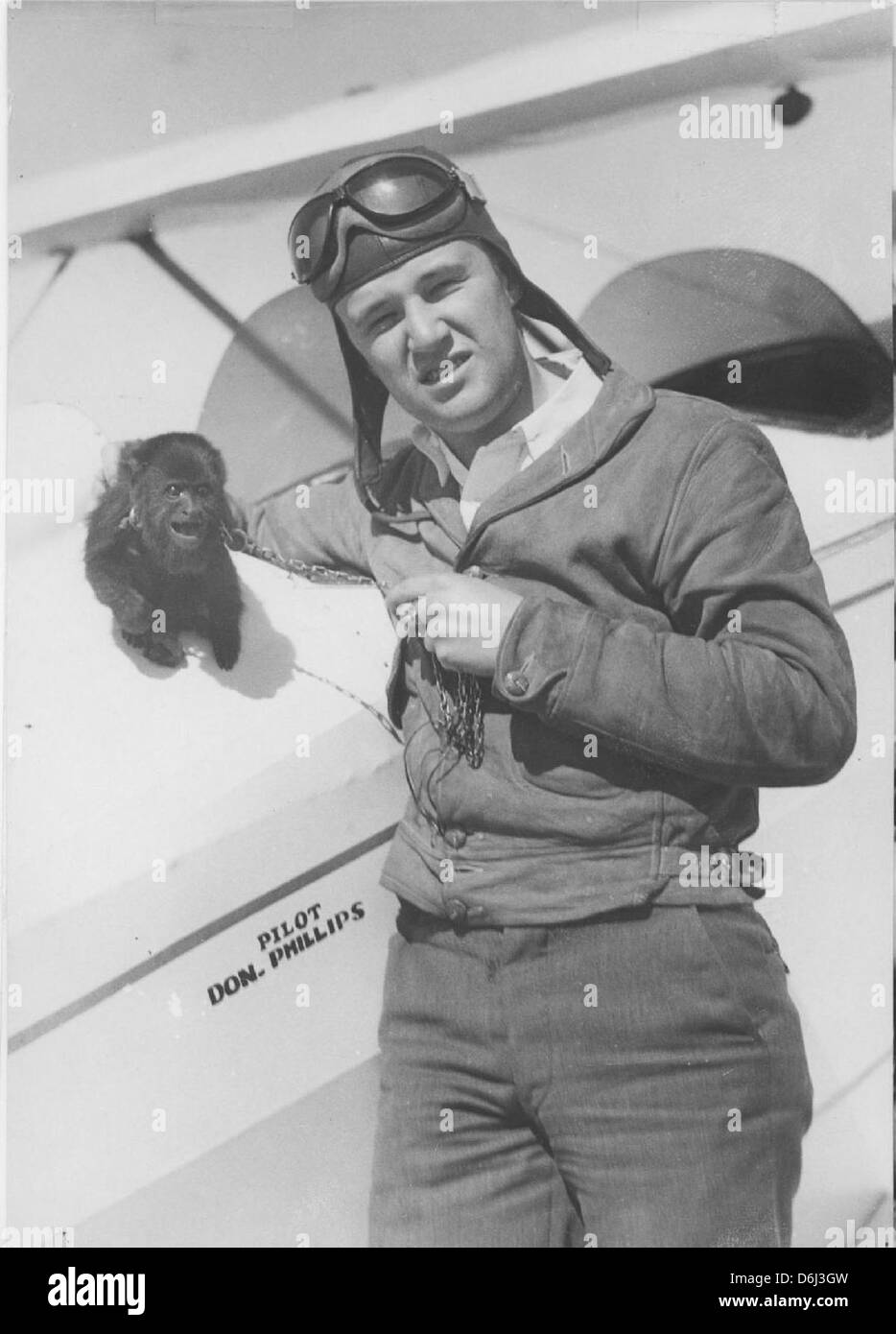 04-02417 Pilot Don Phillips in flight gear with monkey Stock Photo - Alamy