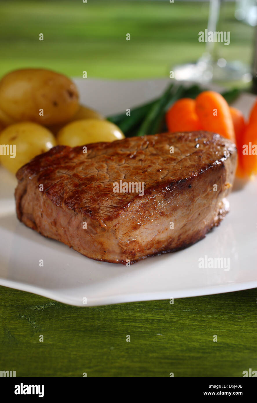 fillet steak beef madellion with carrots green beans and baby potatoes ...