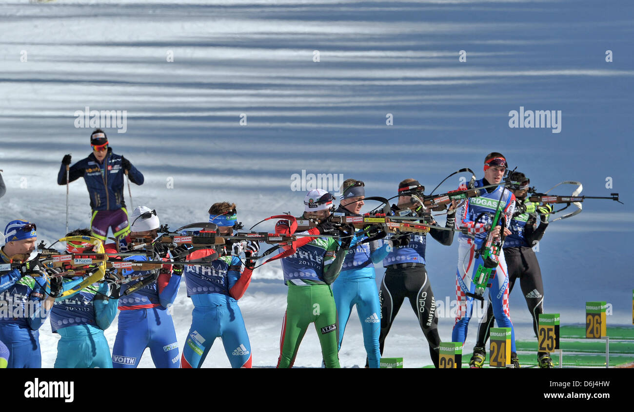 Biathletes practices at the shooting range during men's training round ...