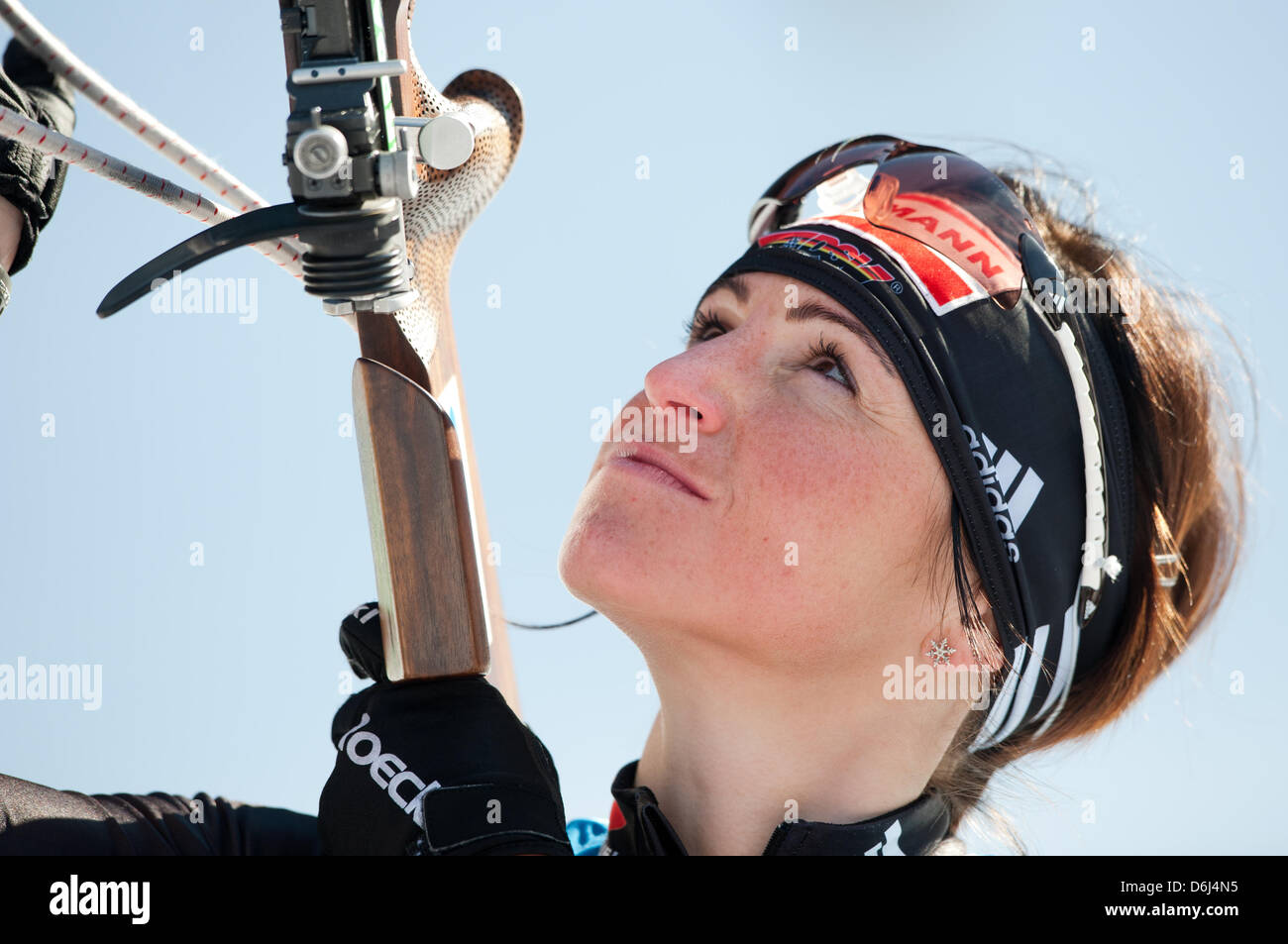 German biathlete Andrea Henkel lifts her rifle during training for the ...