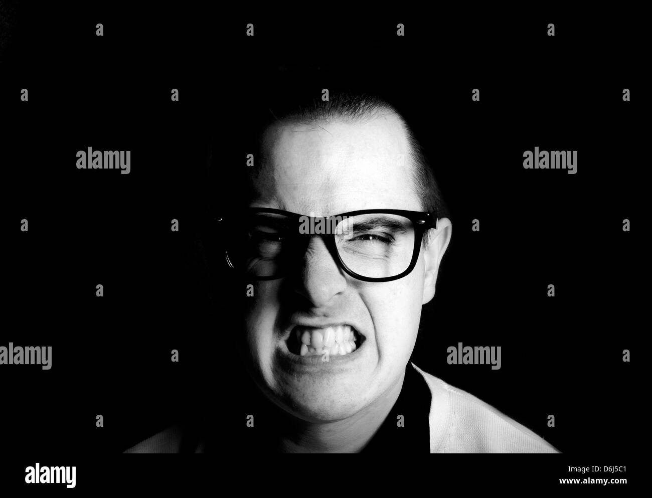 Portrait of angry man shoot in low key technique Stock Photo - Alamy