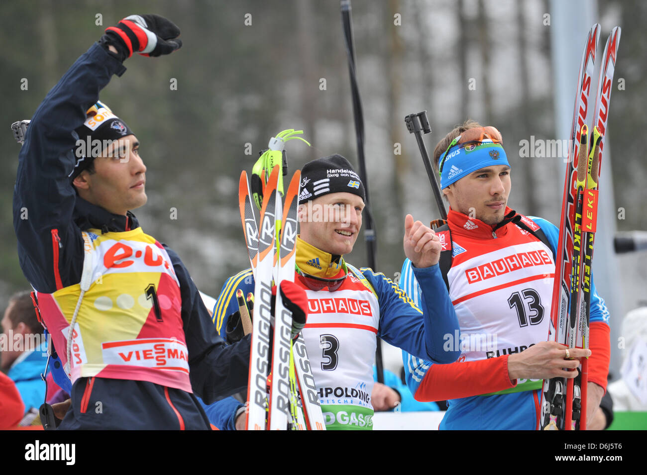 Second placed Swedish biathlete Carl Johan Bergman (C), French winner ...