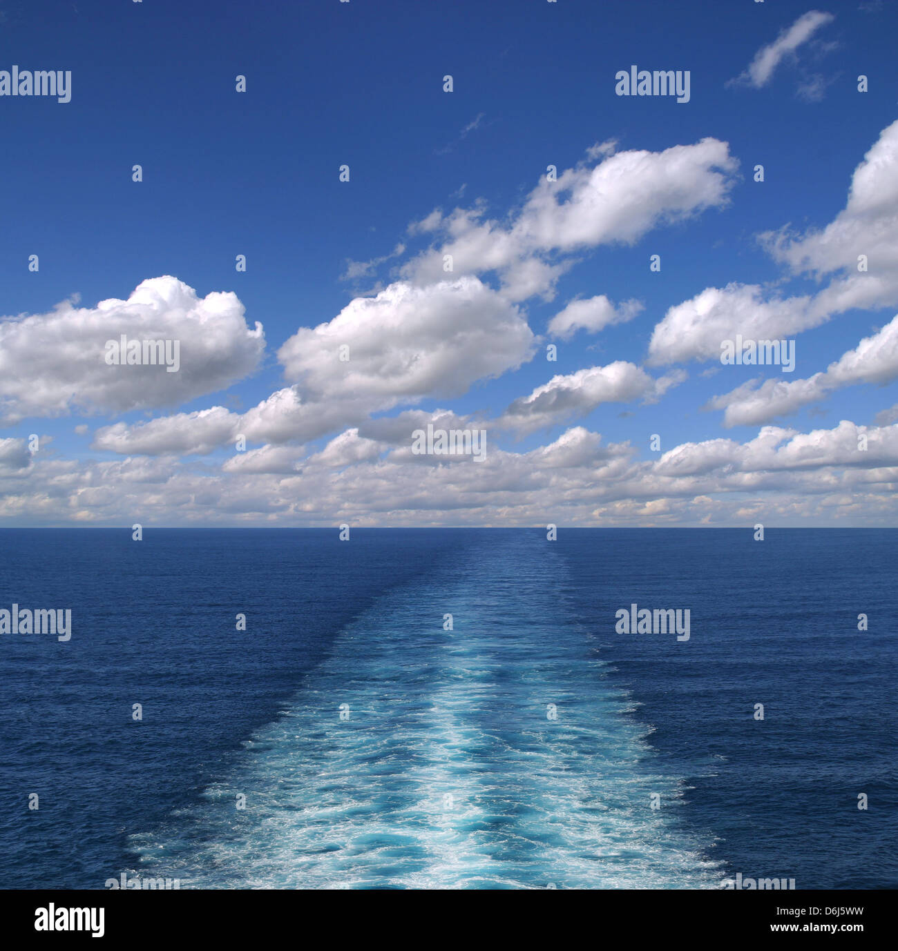 Ship track on the ocean with clouds in the background Stock Photo - Alamy