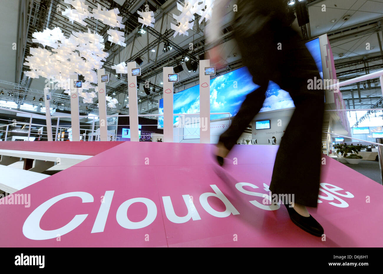 A German Telecom staff member walks down the Cloud Stage at the world's ...