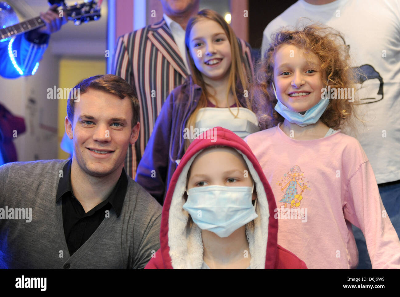 German national soccer goalkeeper Manuel Neuer (L) visits a children's ...