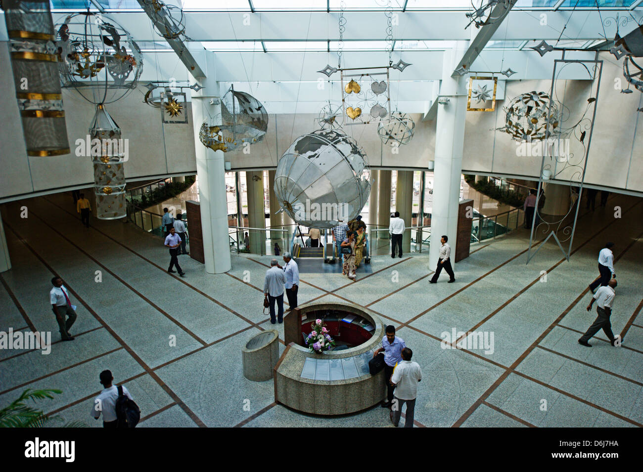 Traders cross the floor in the lobby of the World Trade Center, Colombo ...