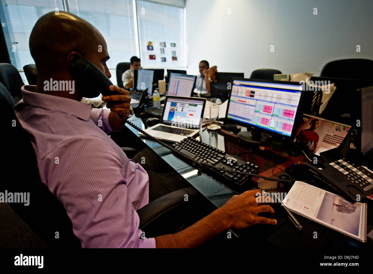 A trader at work on the 32nd floor of the World Trade Center in Colombo ...