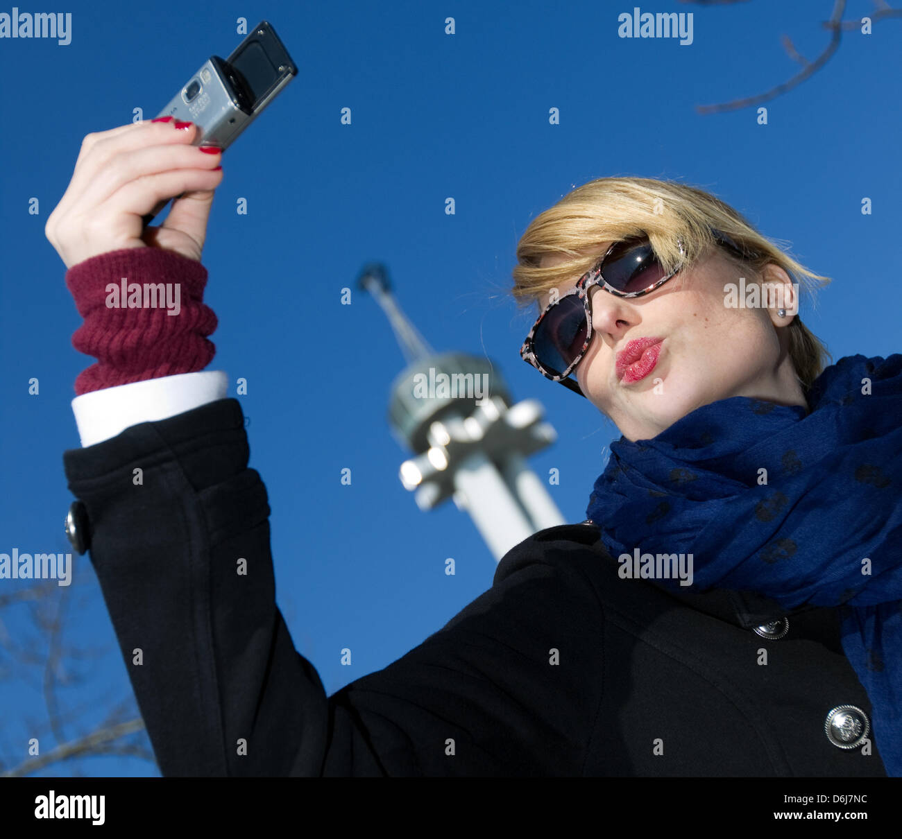 Astrid hold a mobile telephone at the world's largest information ...