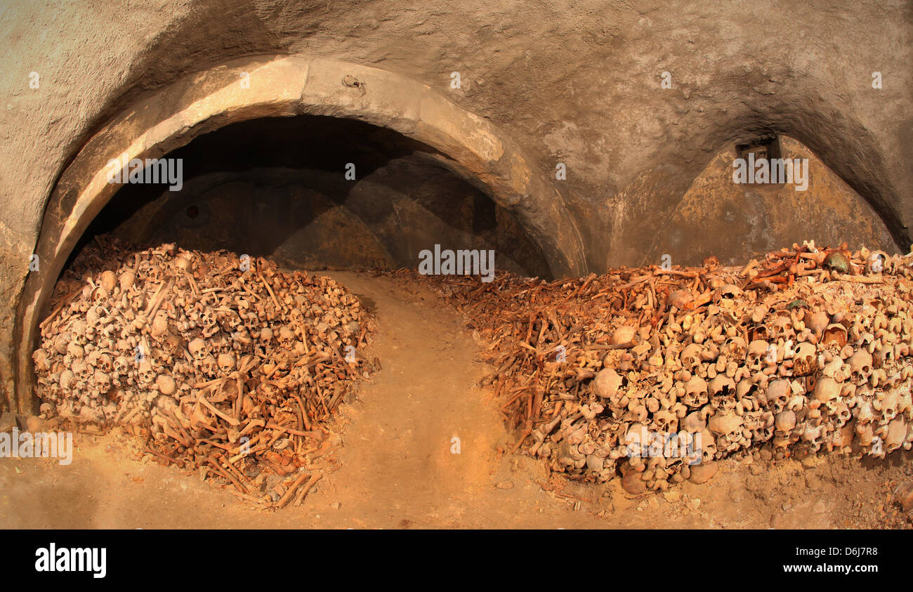 Skulls and bone are stacked under the Church of St. Peter and Paul in ...