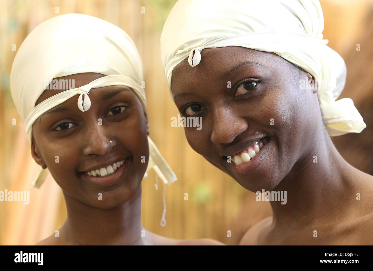 These women from Burundi look into a photographer's camera at the ...