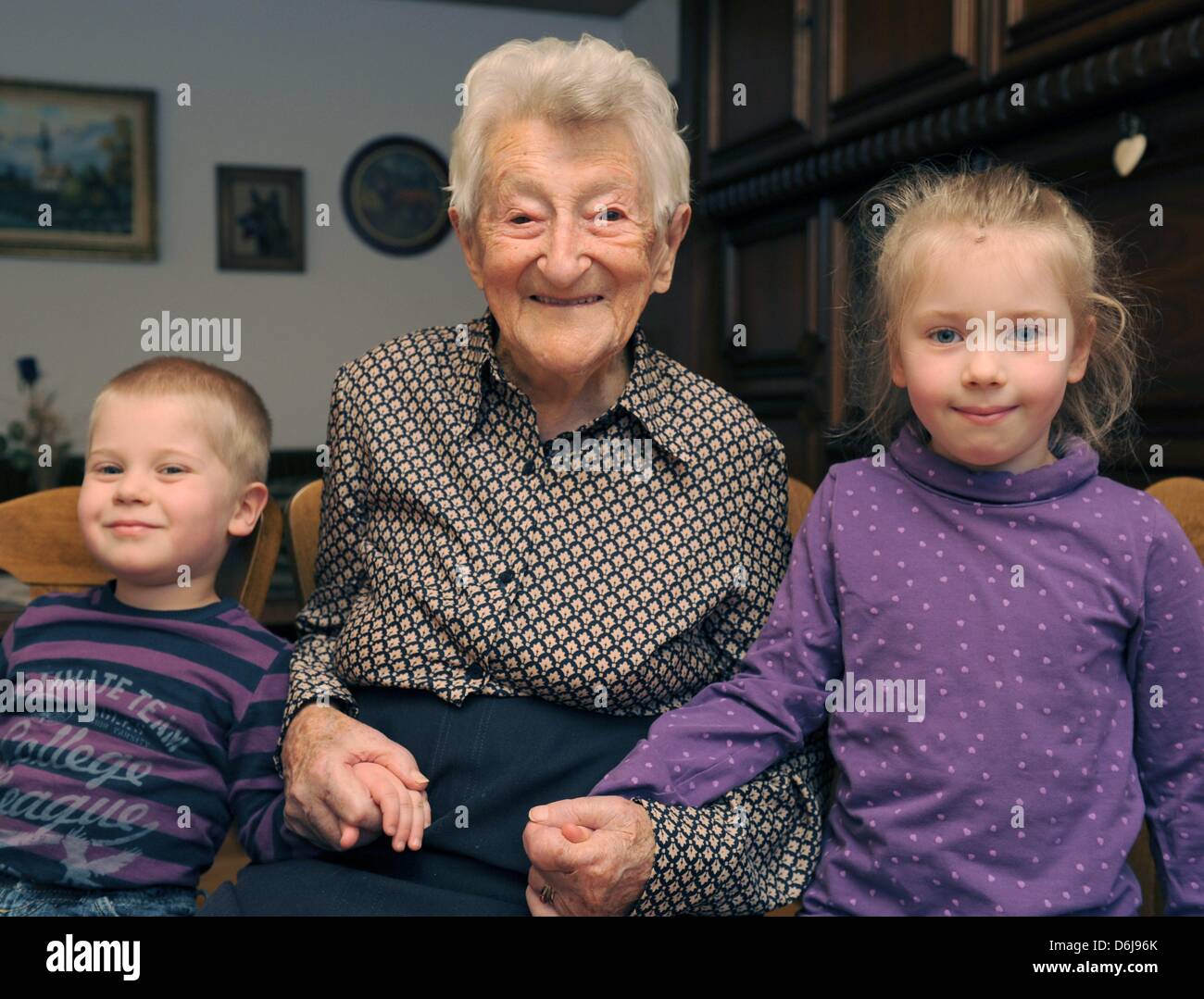 Franziska Rau poses with her great-grandchildren Jason and Fabienne in ...