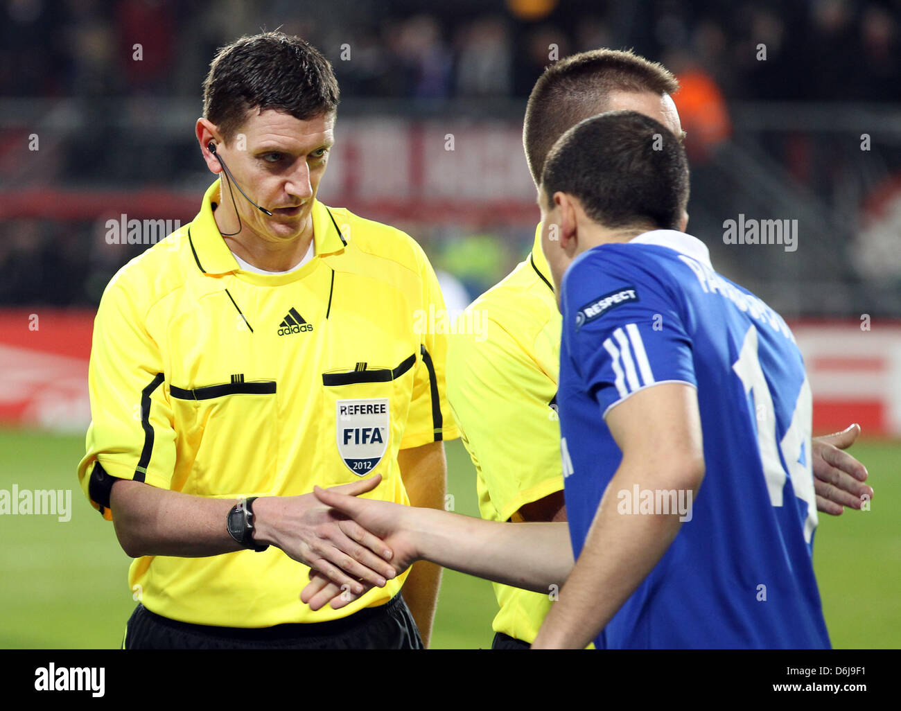 Referee Craig Thomson shake hands with Kyriakos Papadopoulos of Schalke ...