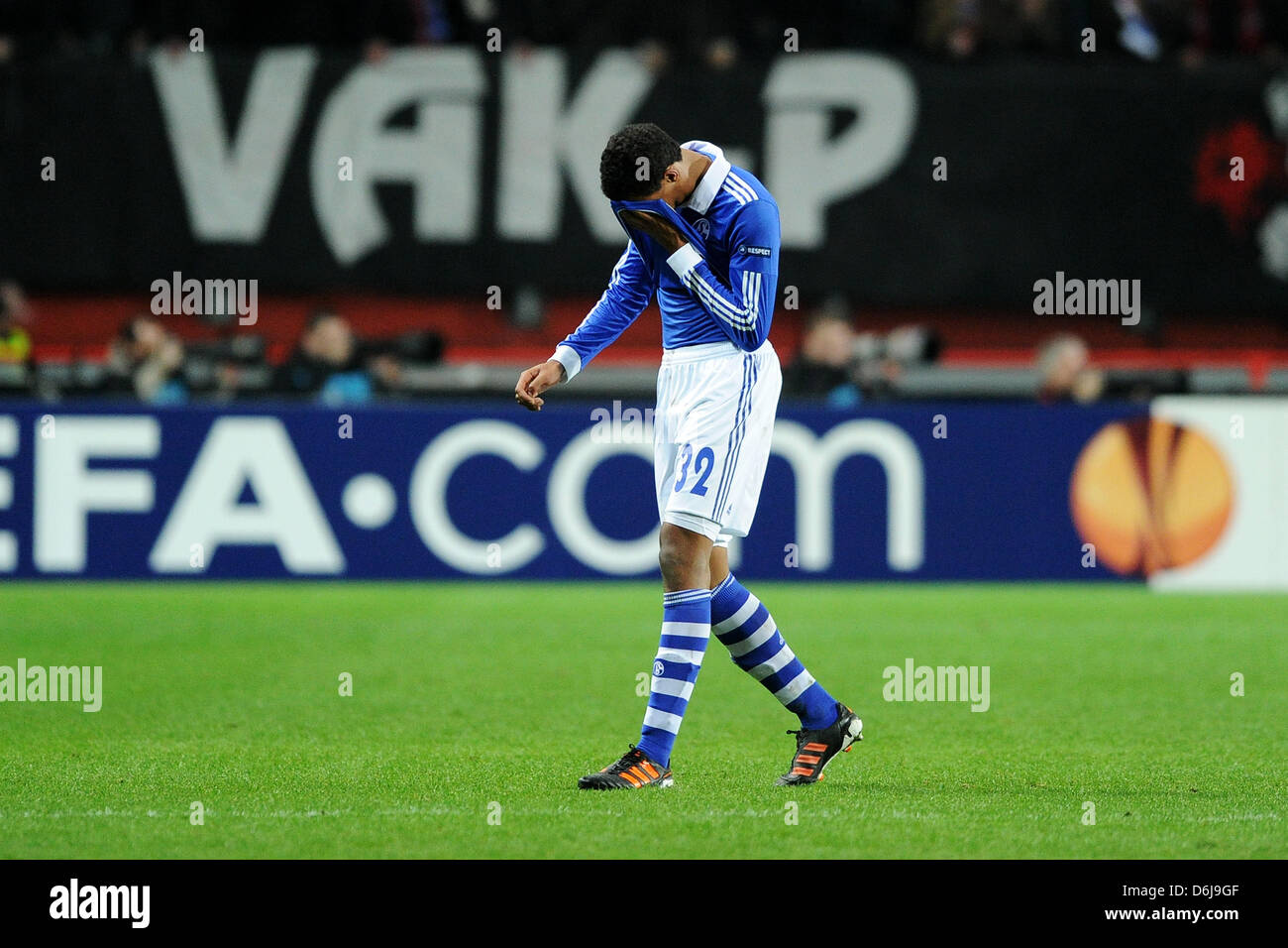 Schalke's Joel Matip walks from the pitch after receiving a red card ...
