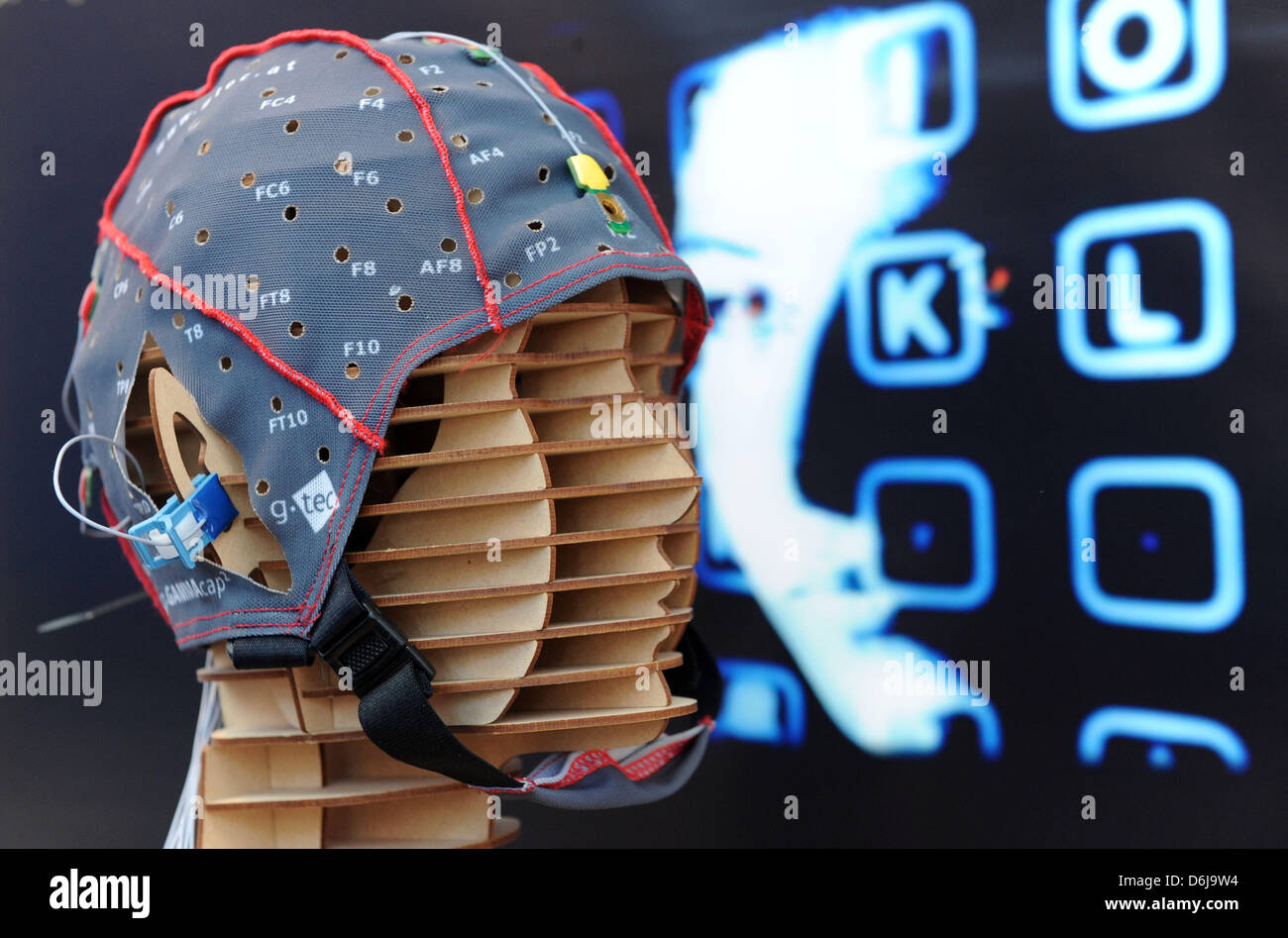 A hat is presented at the booth of g-tec, with which visitors can play ...