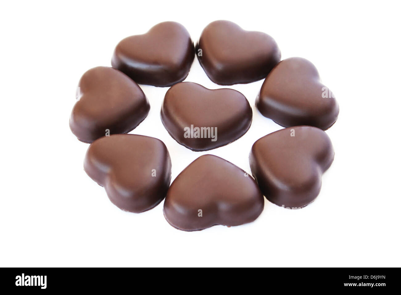 Heart shape chocolates isolated on white background Stock Photo - Alamy